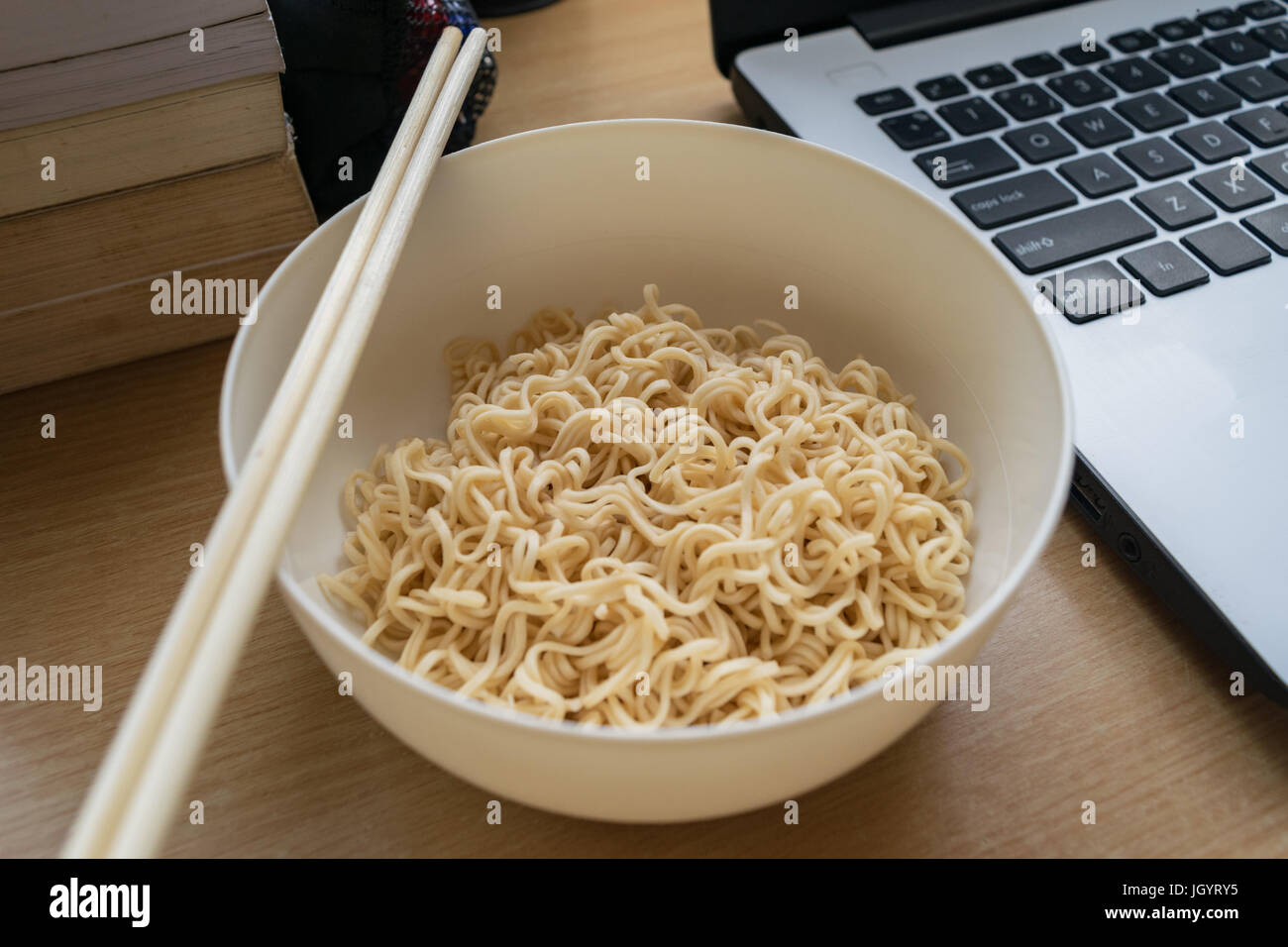 noodles on table wood background with in working Stock Photo - Alamy