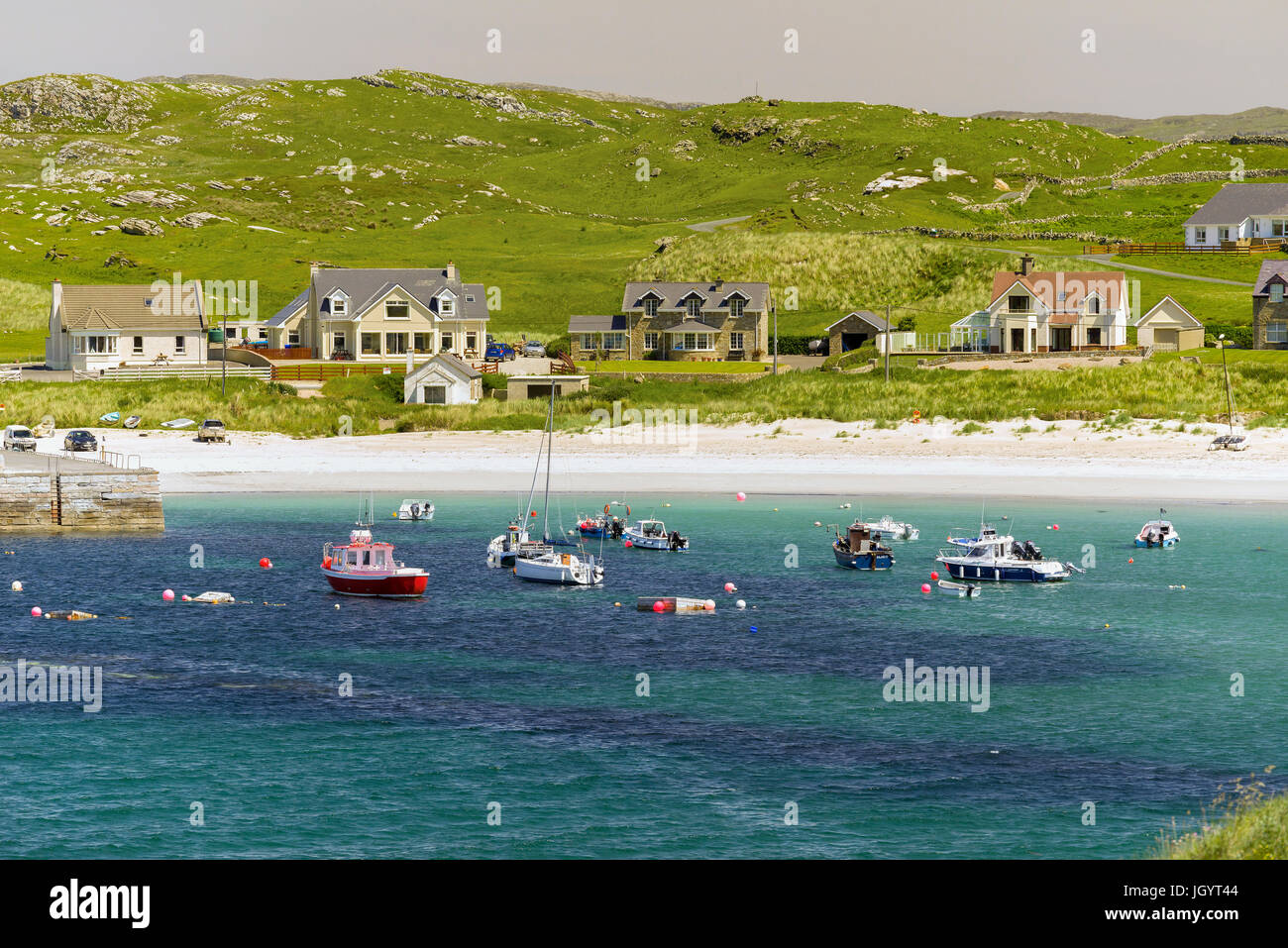 Fishing and pleasure boats moored at Portnablagh on the Causeway Coast ...