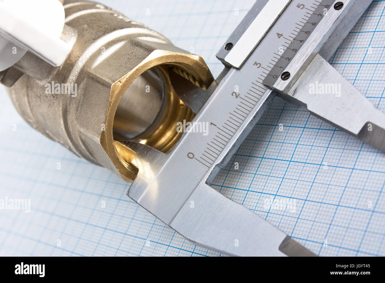 water inlet valve on a background of graph paper Stock Photo - Alamy