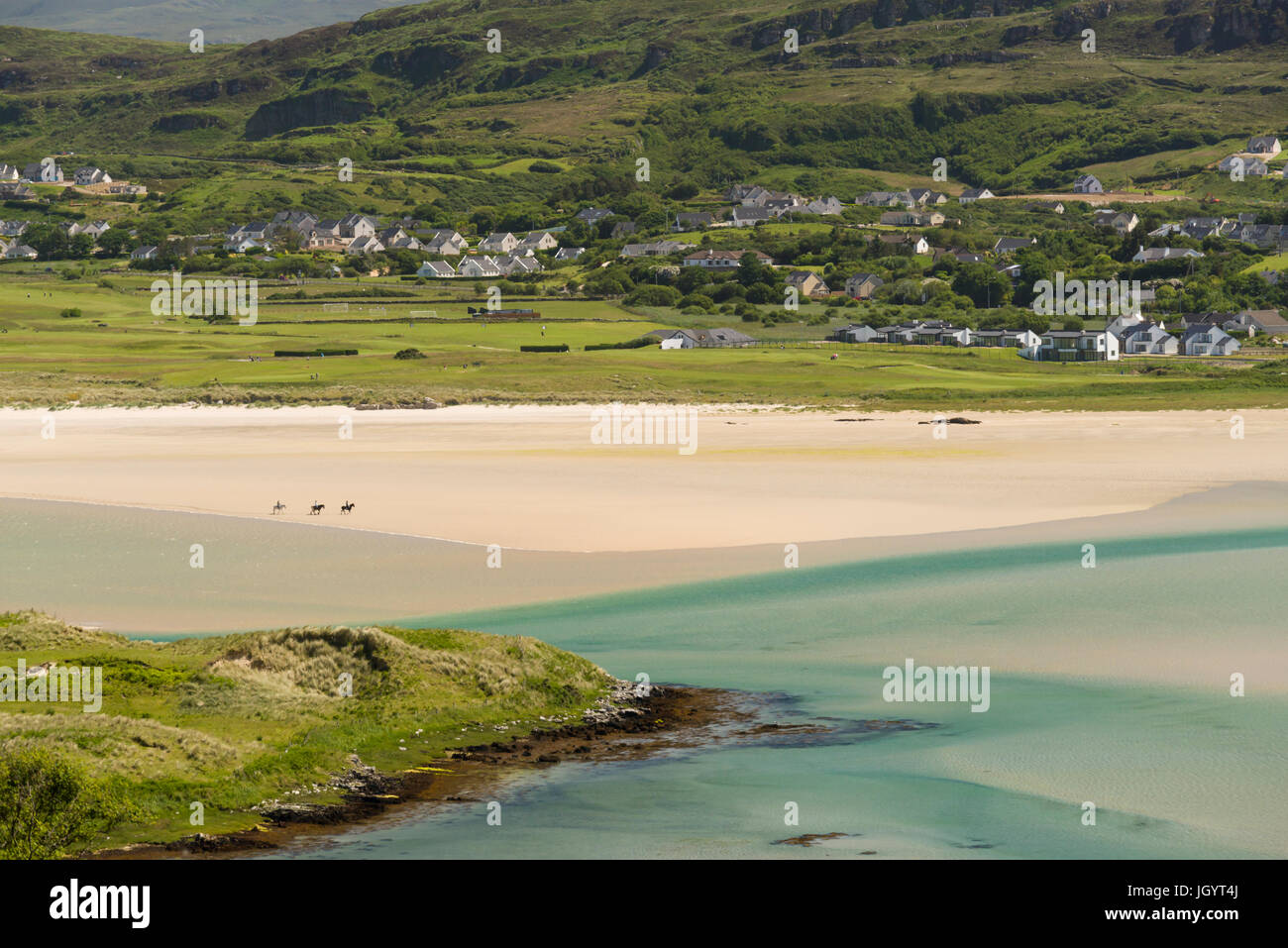 Three horses and riders crossing the beach at Dunfanaghy County Donegal ...