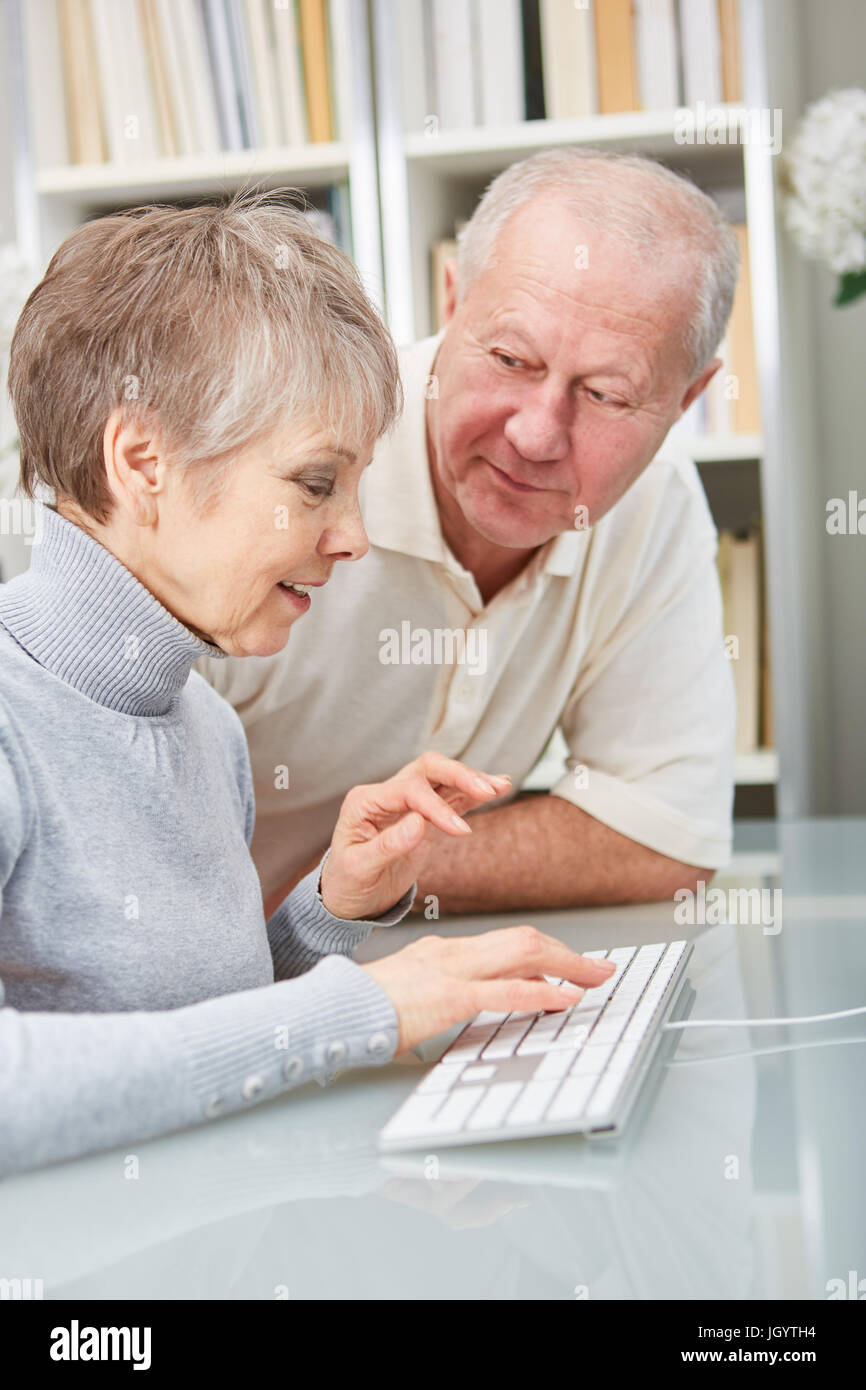 Seniors learn in computer class about technology Stock Photo - Alamy