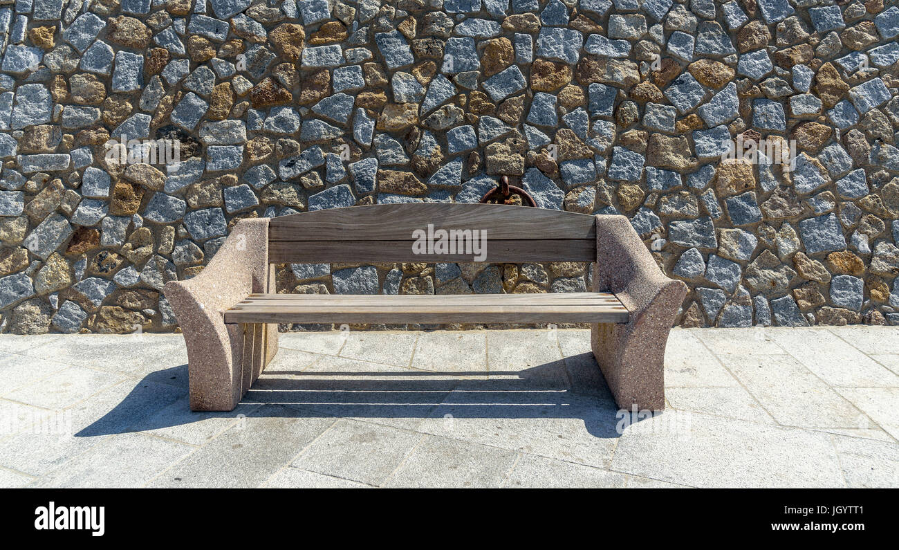bench on stone wall Stock Photo - Alamy