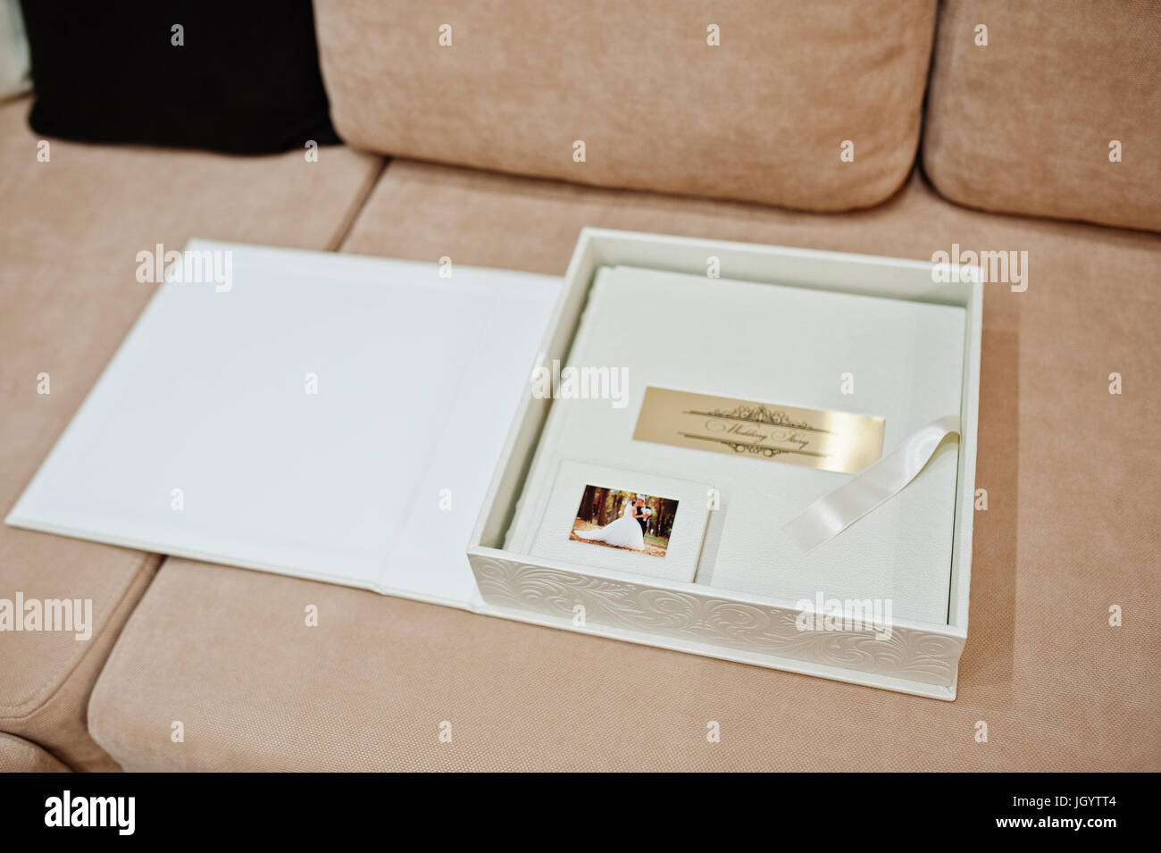 Awesome and elegant white box with wedding photobook or photo album ...