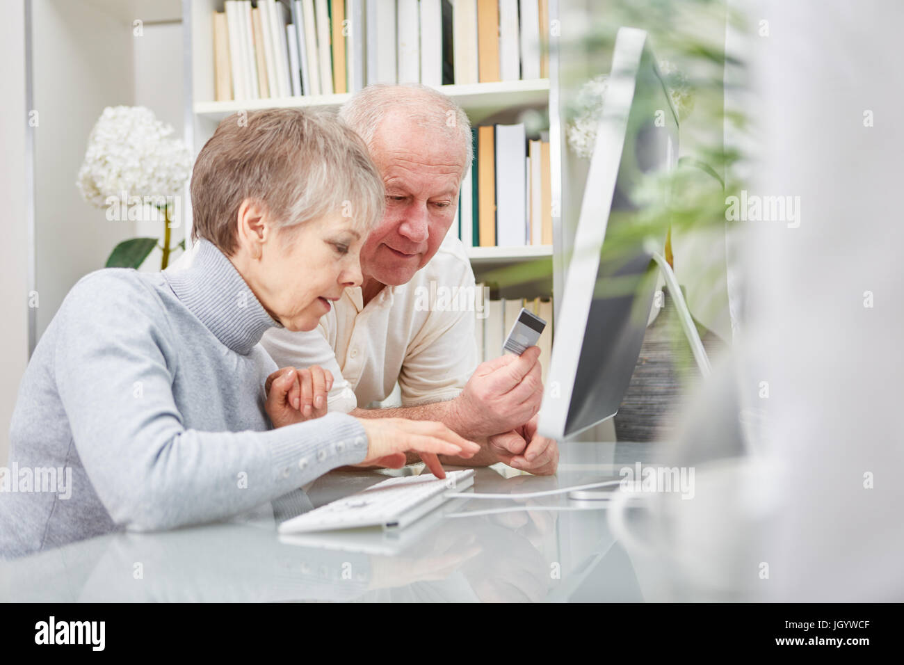 Couple of seniors shopping in the internet using online banking Stock ...
