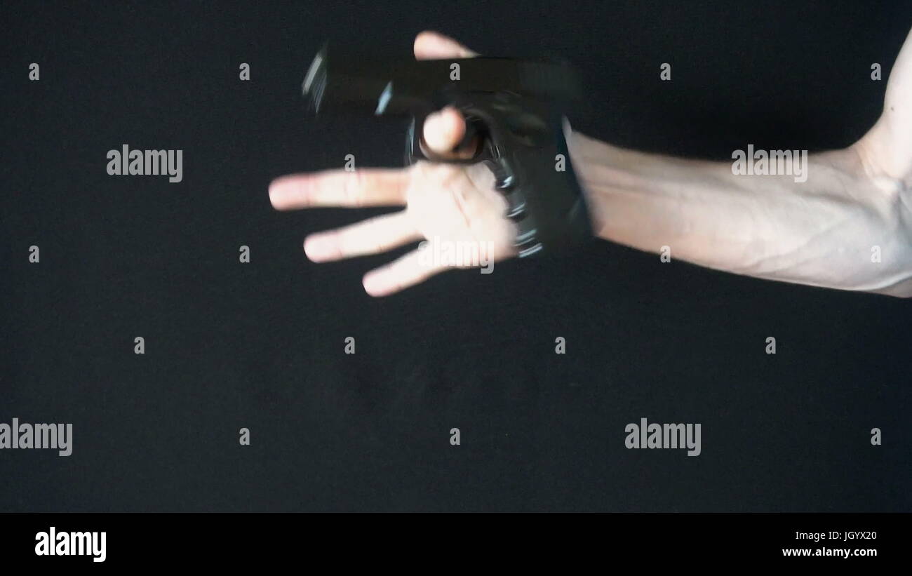 the young man turns on his finger gun black Stock Photo - Alamy
