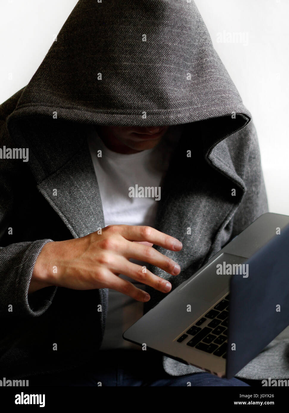 Hacker with laptop Stock Photo - Alamy
