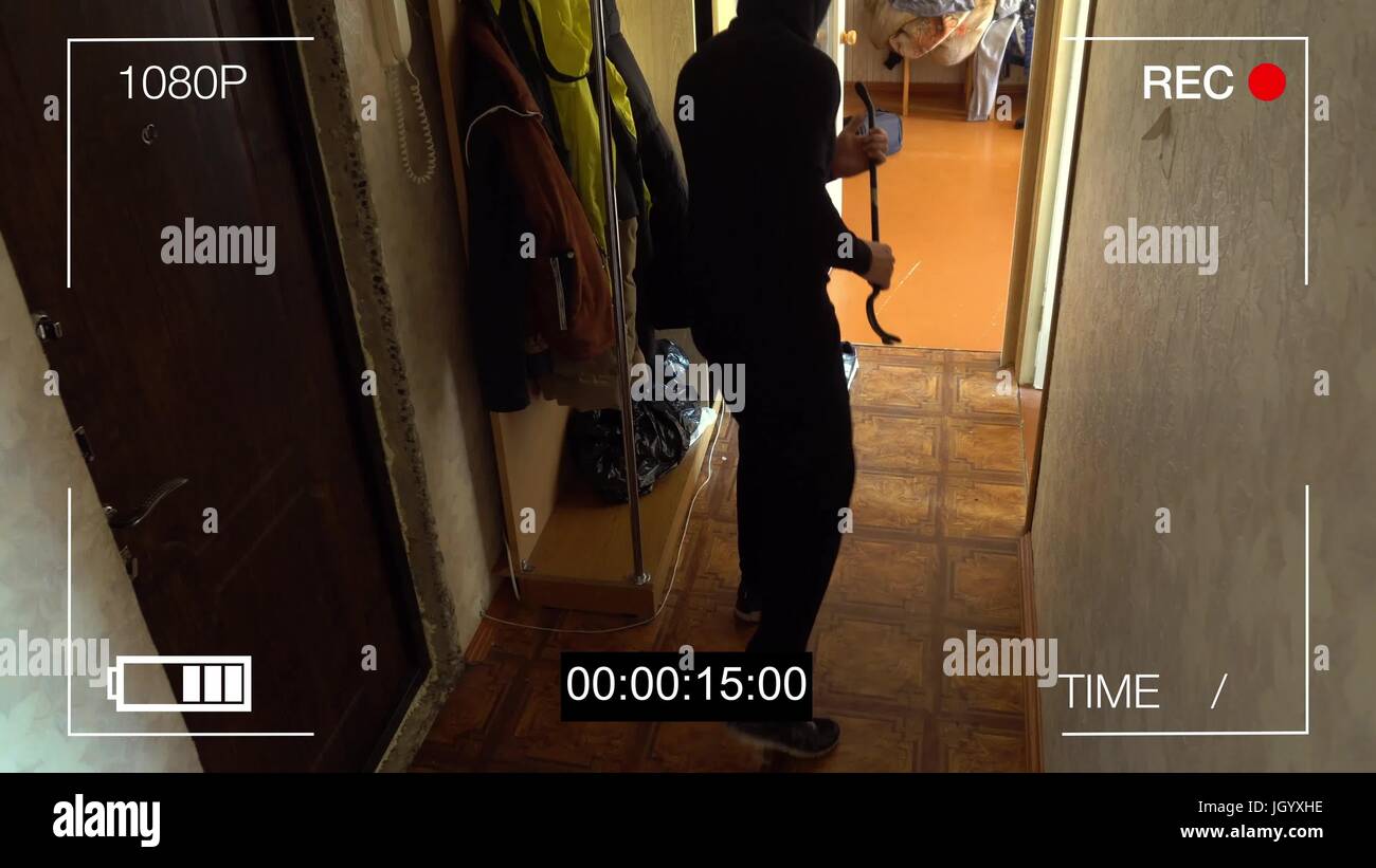 CCTV camera caught thief with a crowbar broke into the apartment Stock ...