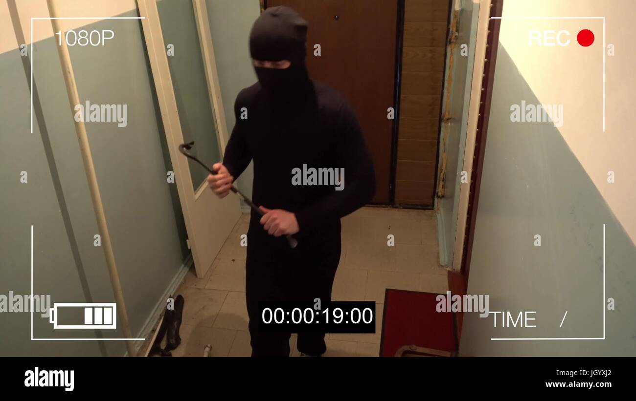the robber in the mask c has a crowbar in his hands were under camera ...