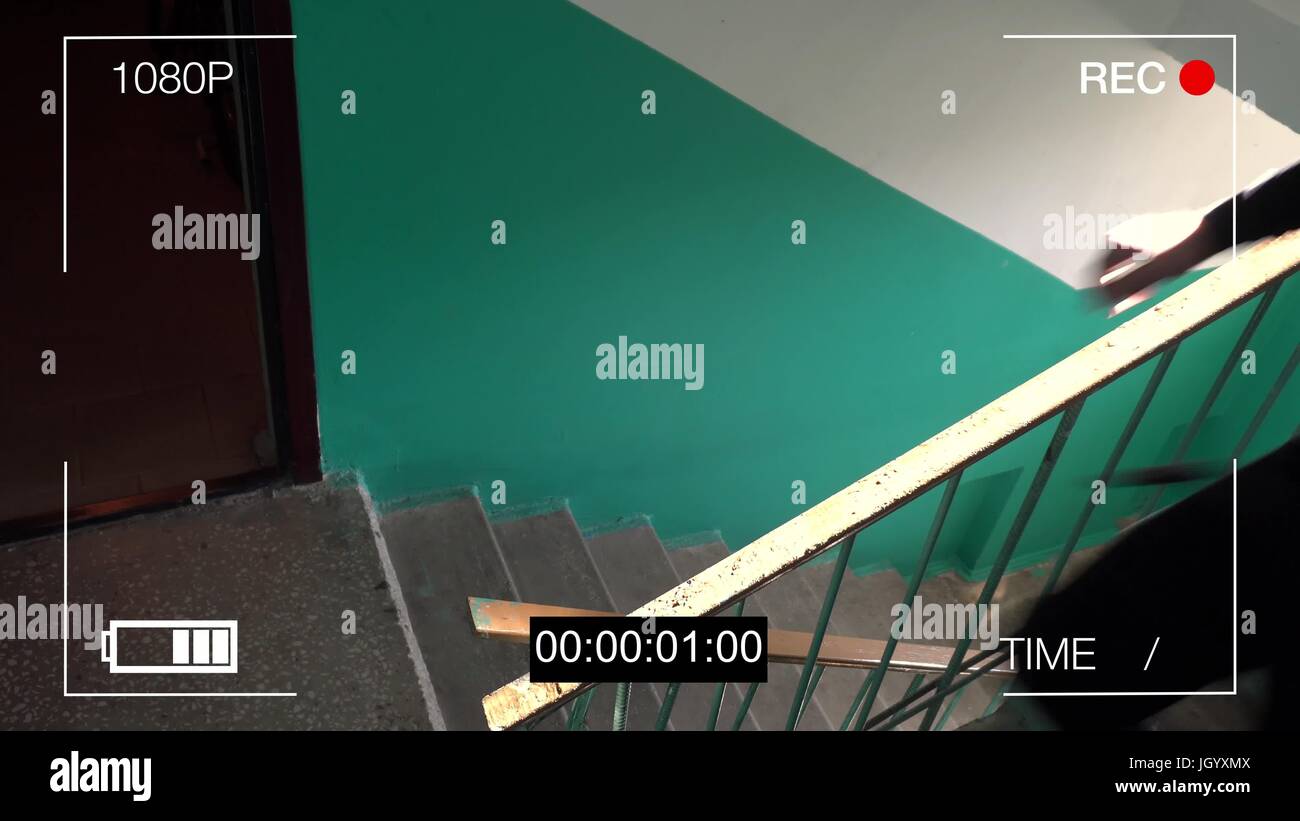 surveillance camera caught the robber in a mask running off Stock Photo ...