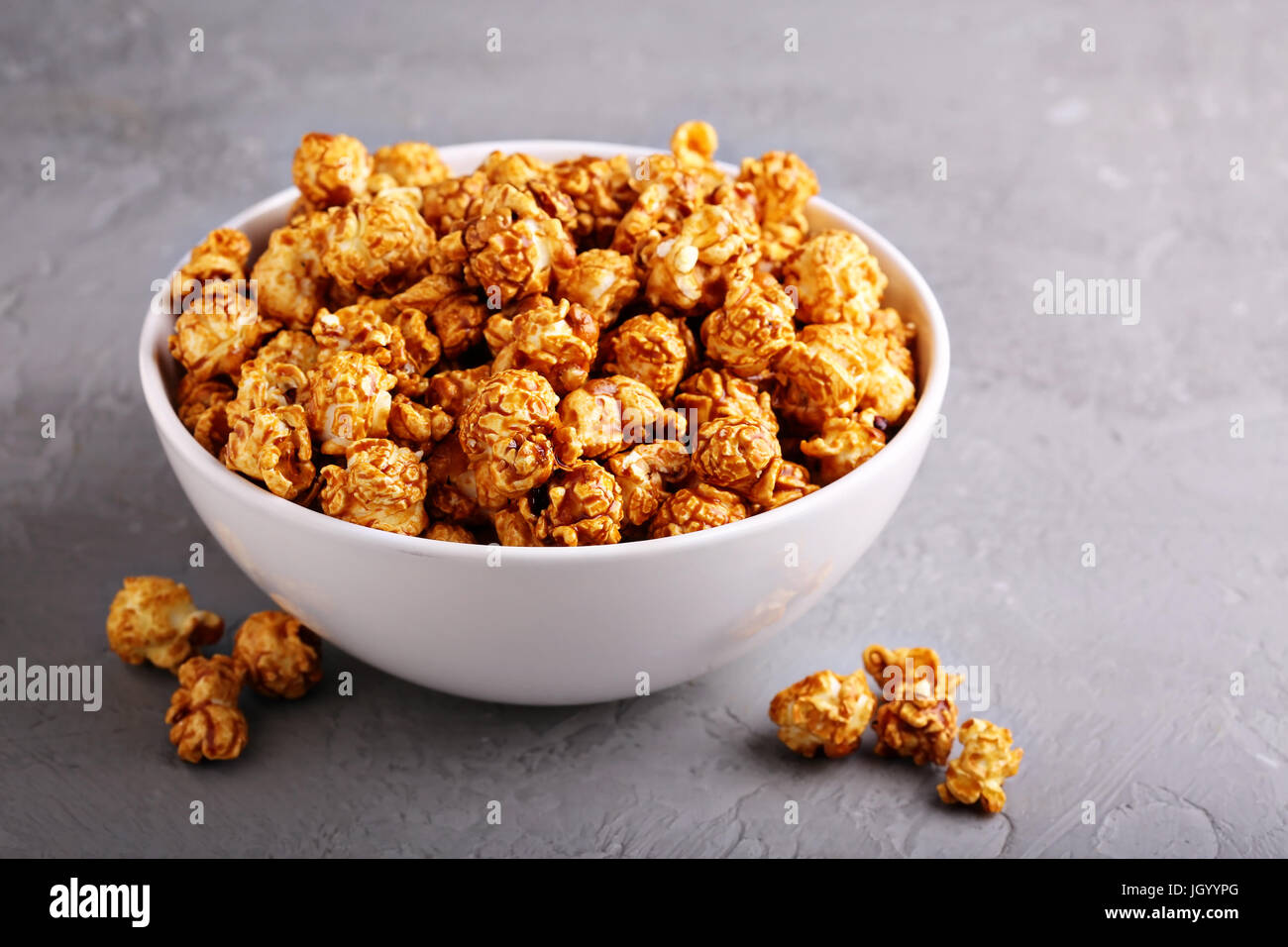 Caramel popcorn in a bowl Stock Photo - Alamy