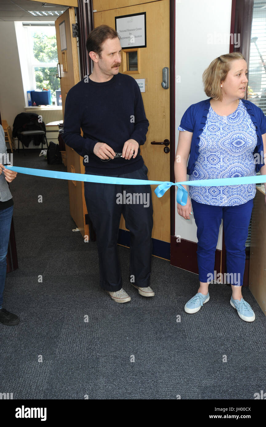 Staff and families and children using the chartiy project hi-res stock ...