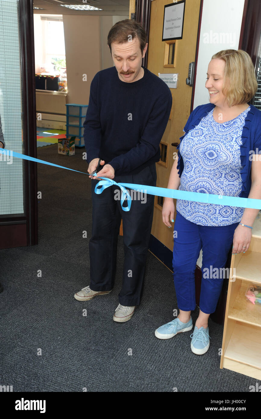 Staff and families and children using the chartiy project hi-res stock ...
