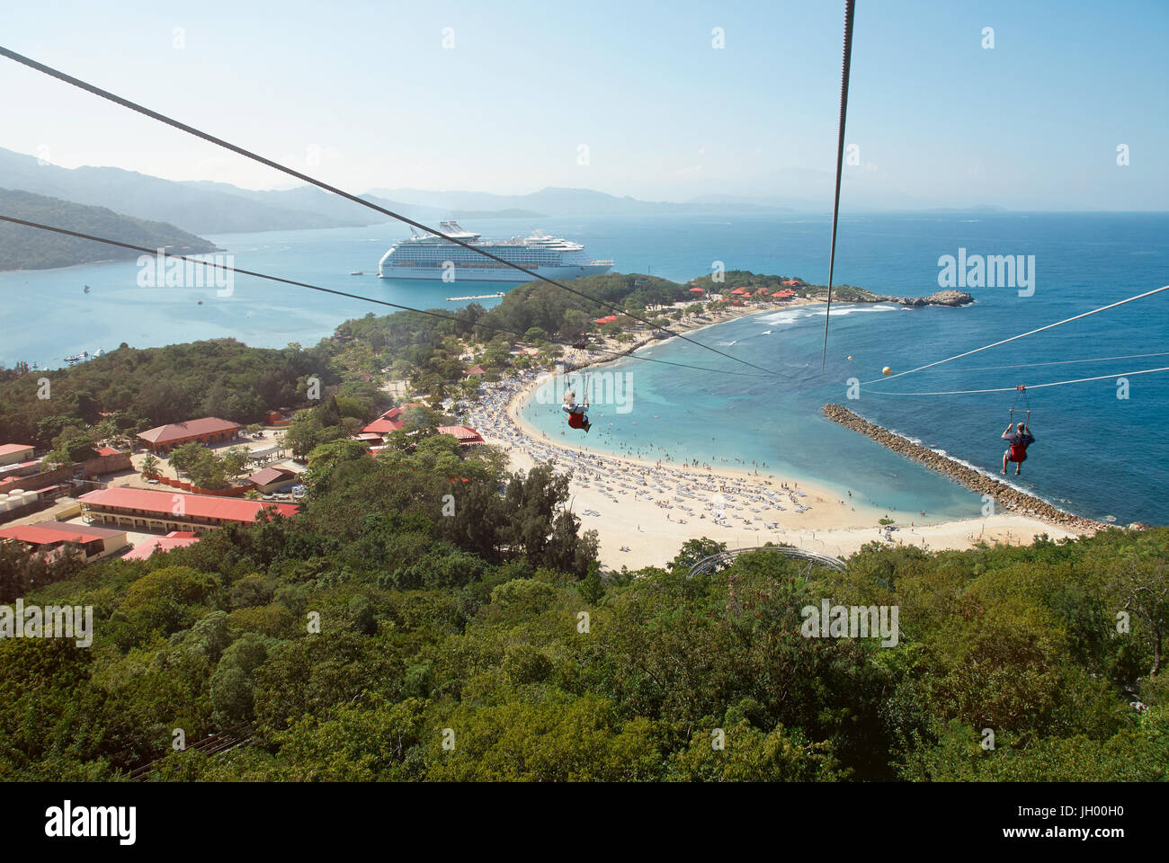 People doing zip line in caribbean coast on vacation. Cruise vacation ...