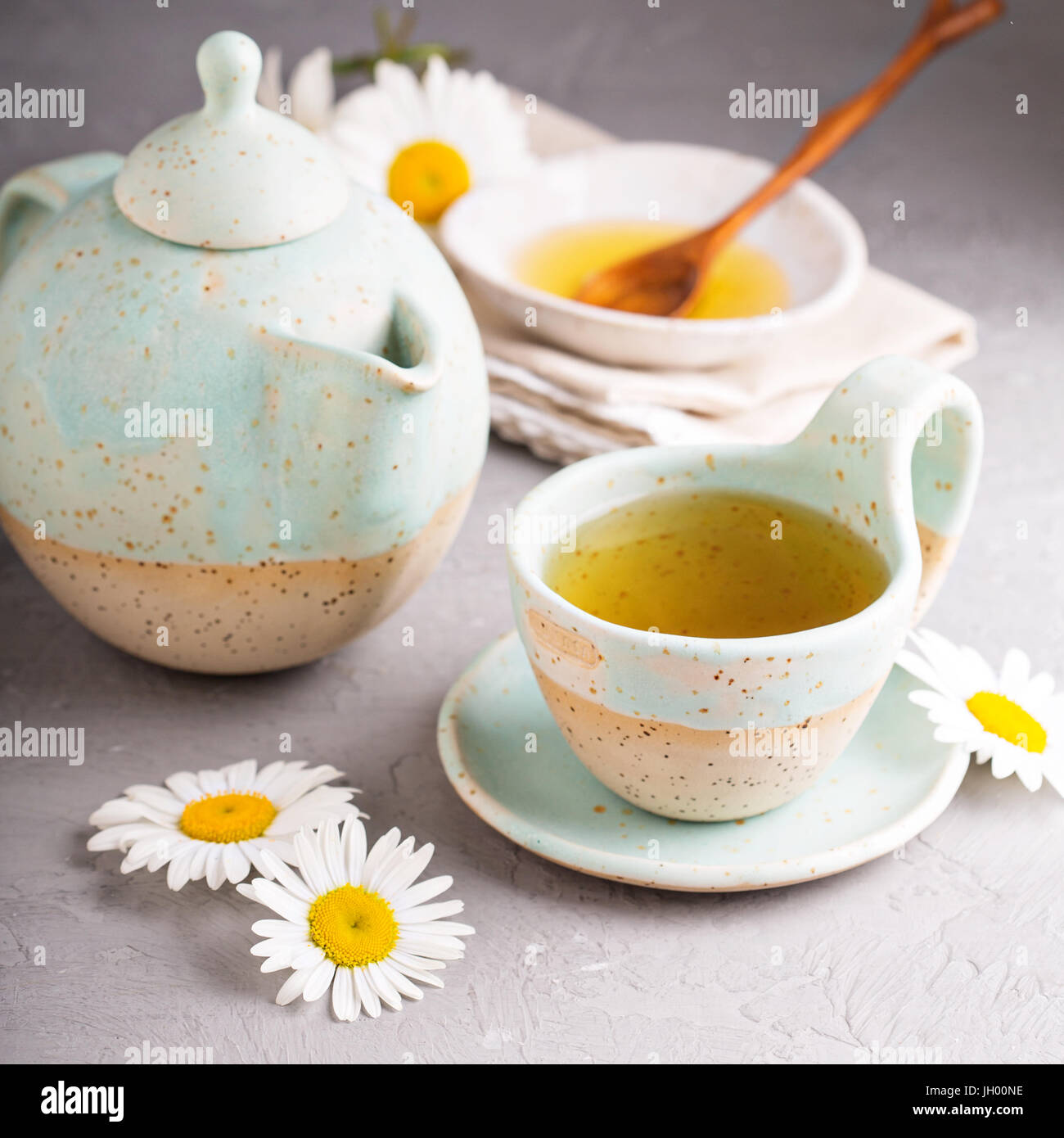 Camomille tea in handmade ceramic cup Stock Photo - Alamy