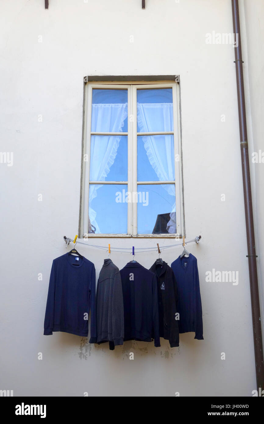 Clothing hung outside of a window, Florence, Italy Stock Photo - Alamy