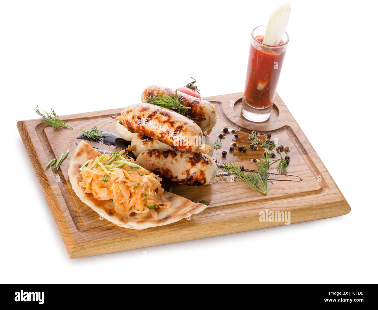 Sausages on wooden board Cut Out Stock Images & Pictures - Alamy