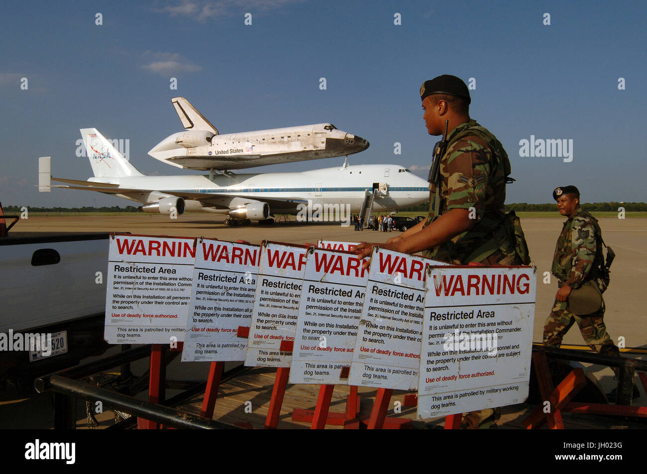 Air Force Security Forces personnel set up a security perimeter around ...
