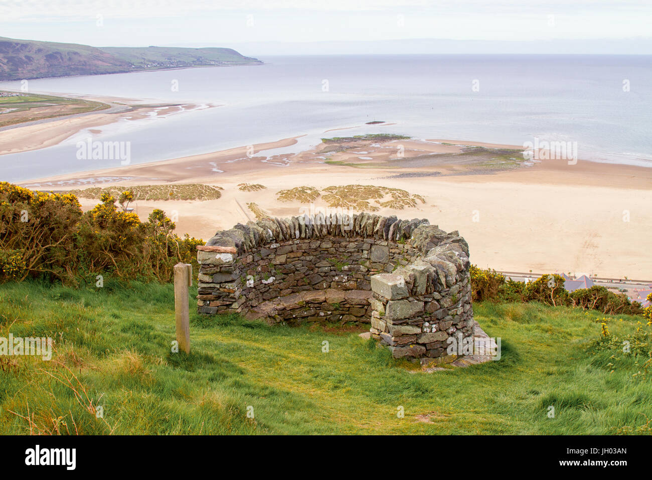 Landscape featuring the old fort stone look out above Barmouth beach ...