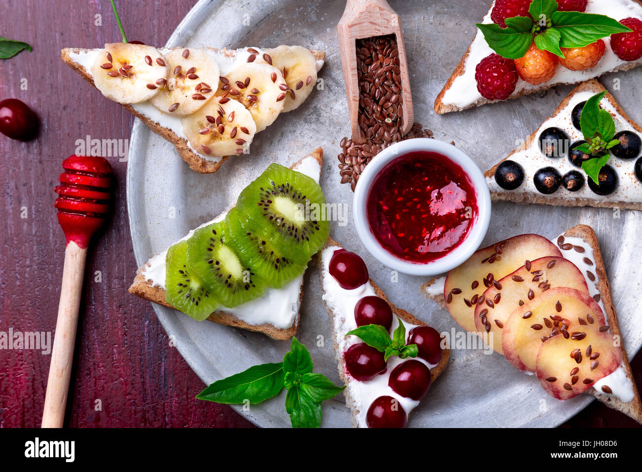 Fruit toast on red background. Healthy breakfast. Clean eating. Dieting ...