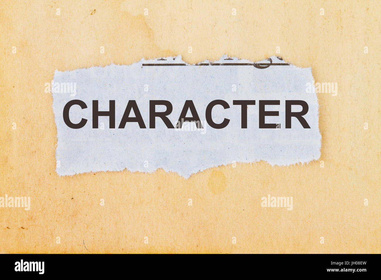 Character newspaper cutout in an old paper background Stock Photo - Alamy