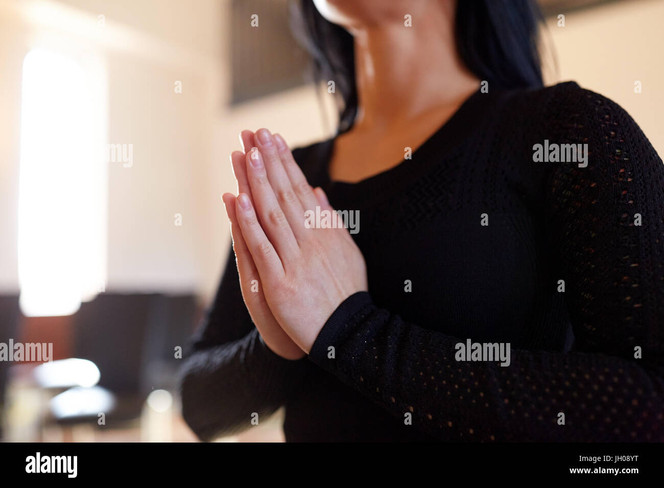 close up of sad woman praying god in church Stock Photo - Alamy