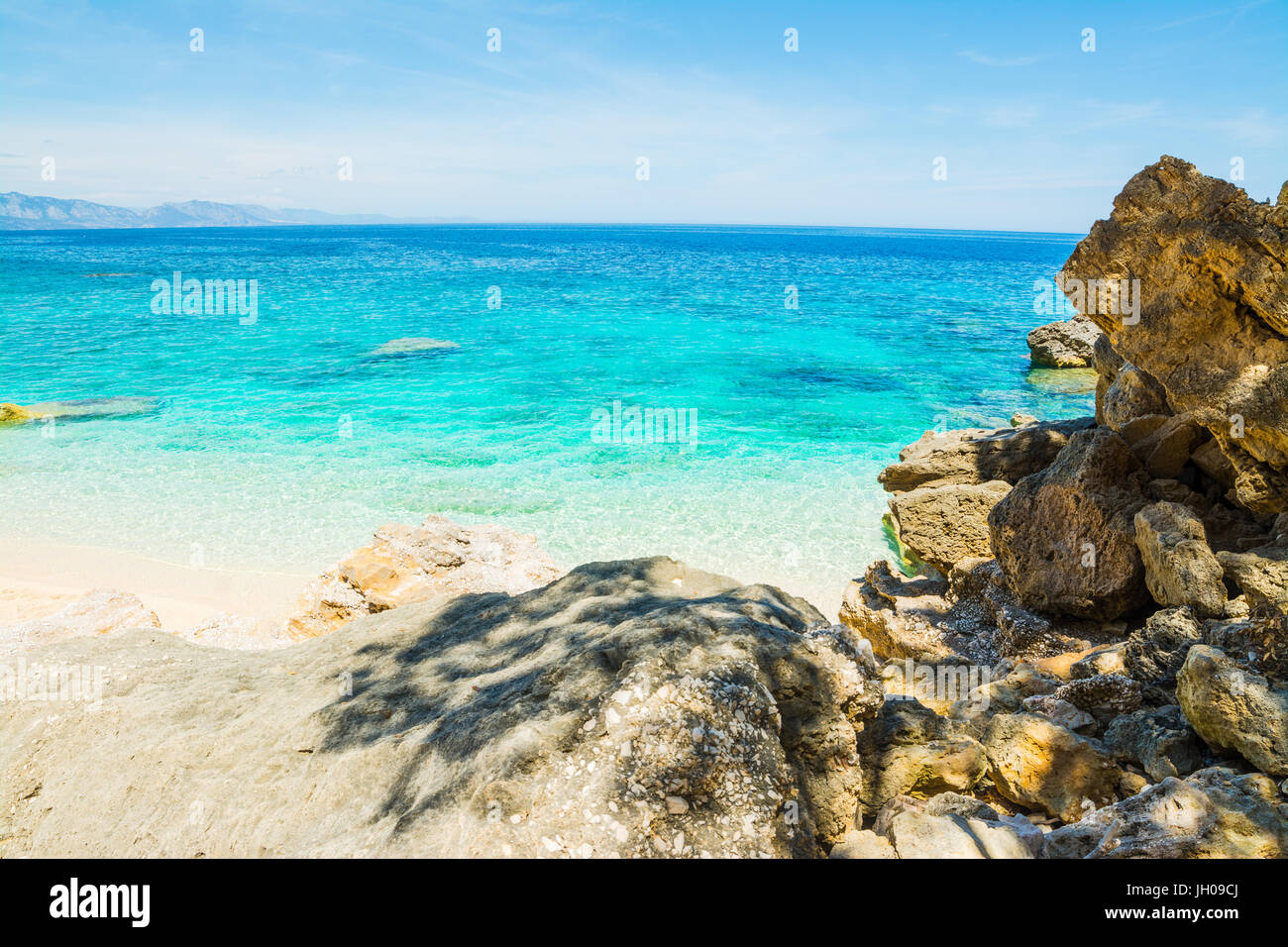 rocks in Cala Mariolu beach Stock Photo - Alamy