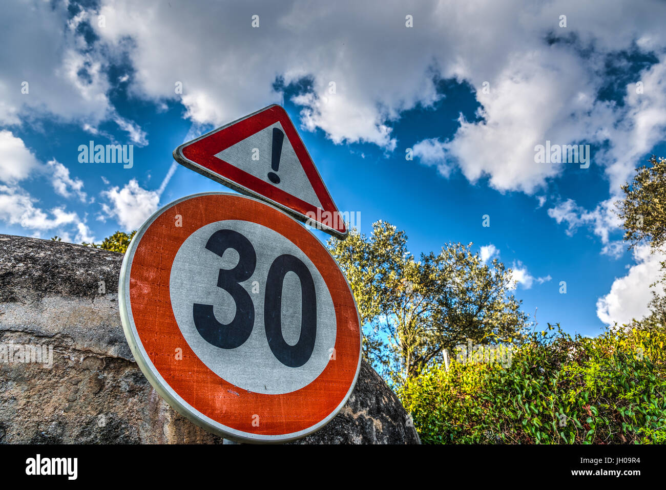 Speed limit sign under a cloudy sky in Italy Stock Photo - Alamy