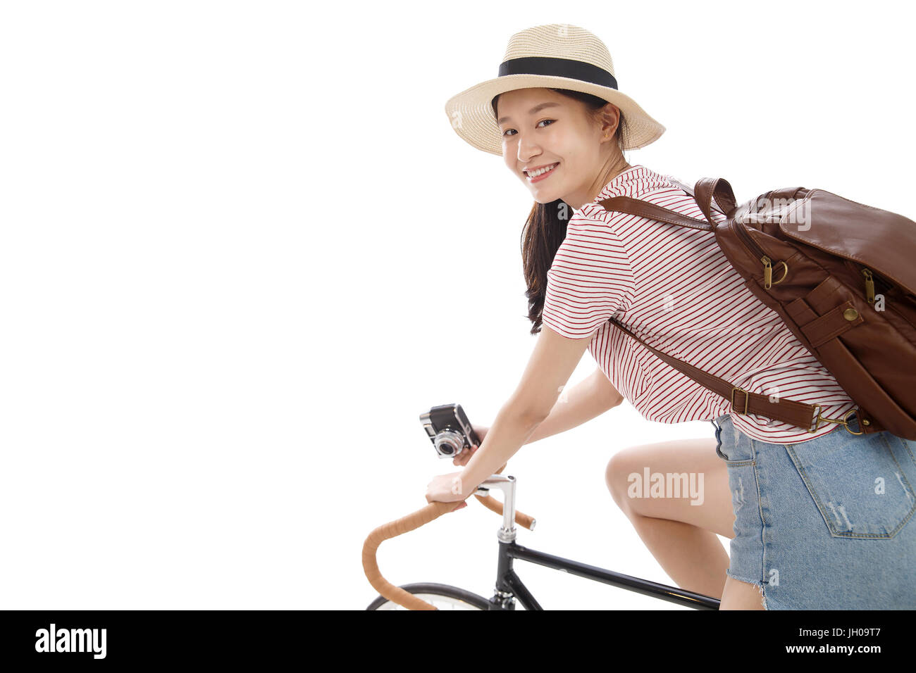 Young woman riding bicycle Stock Photo - Alamy