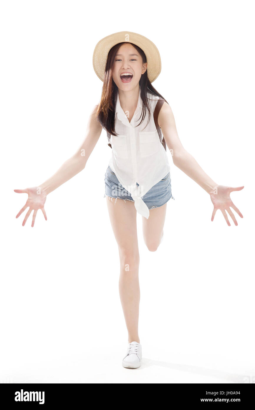 Portrait of young woman running forward Stock Photo - Alamy