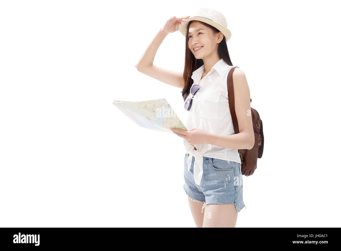 Young woman on travel checking map Stock Photo - Alamy