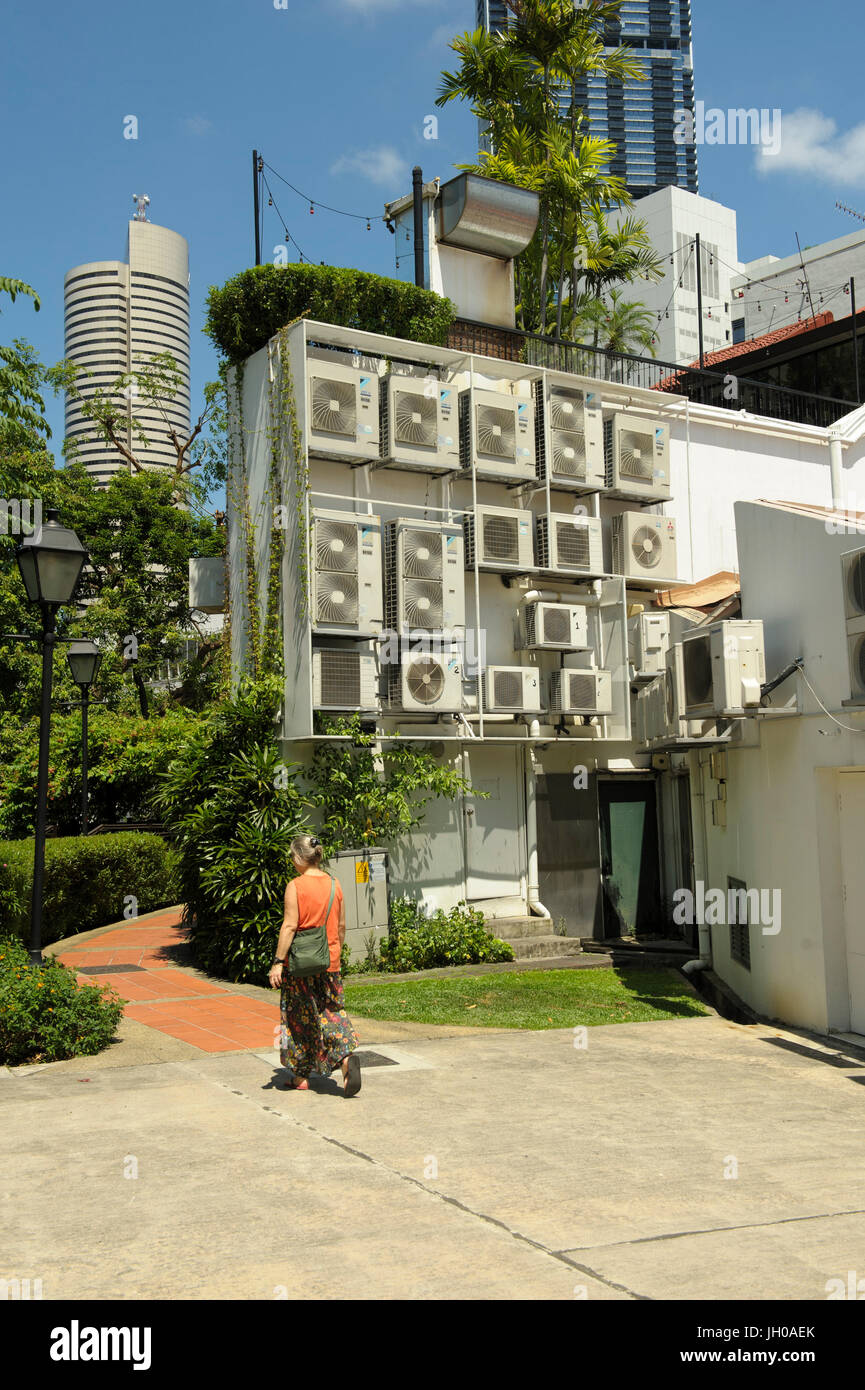 A bank of air-conditioners on a small apartment block, Singapore Stock ...