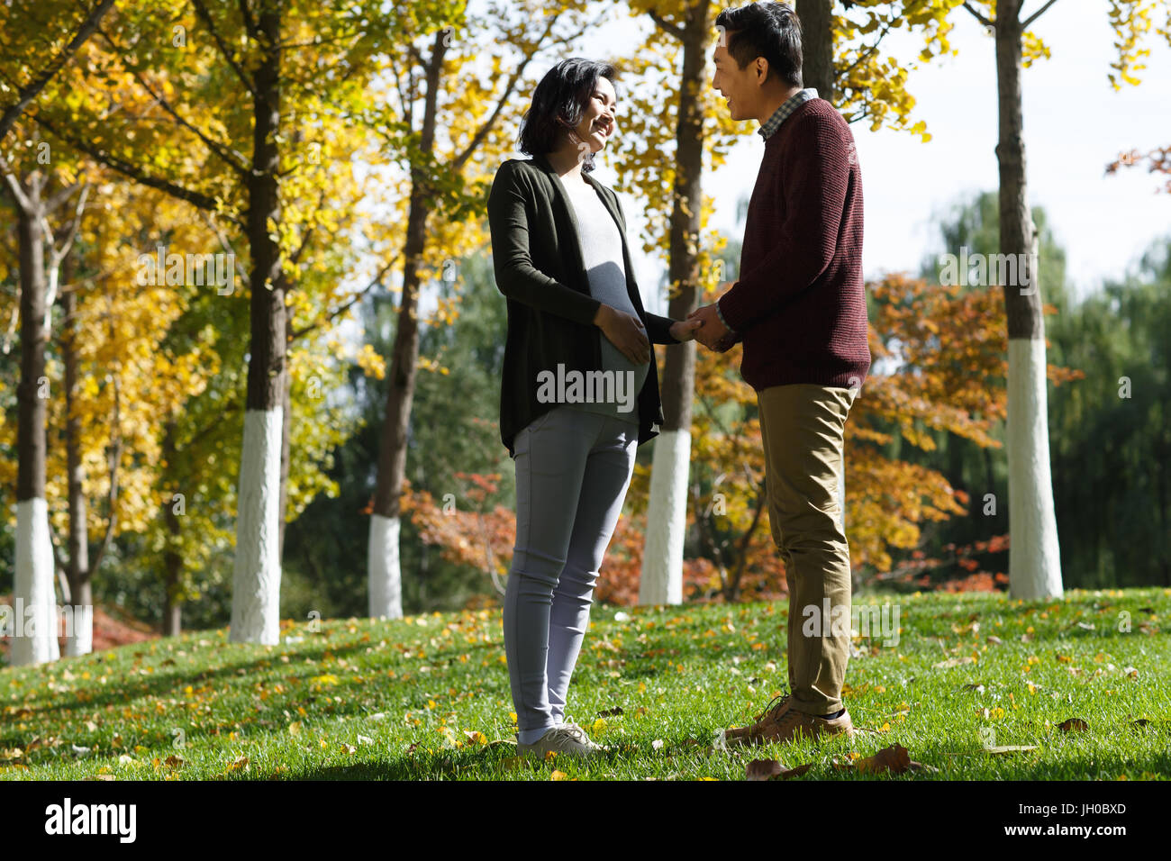 Young couple taking a walk outside Stock Photo - Alamy