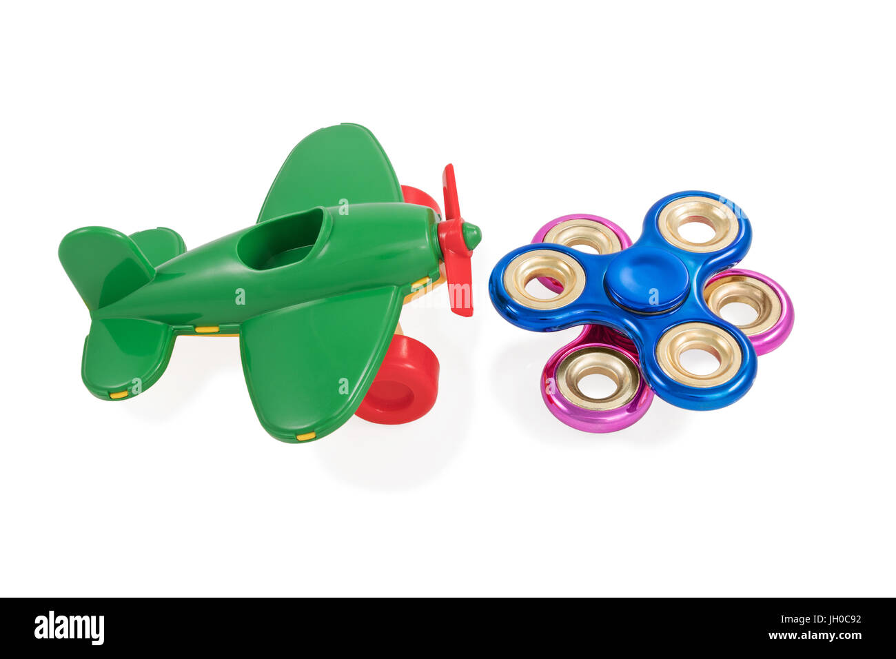 Two spinners and a toy plane Stock Photo - Alamy