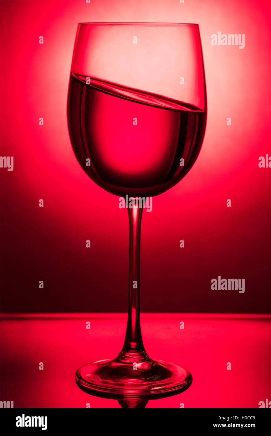 Splash of wine in a glass Stock Photo - Alamy
