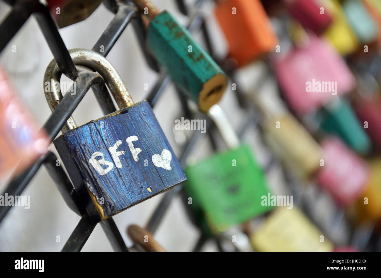 Best friend forever, BFF padlocks locked on iron chain Stock Photo - Alamy