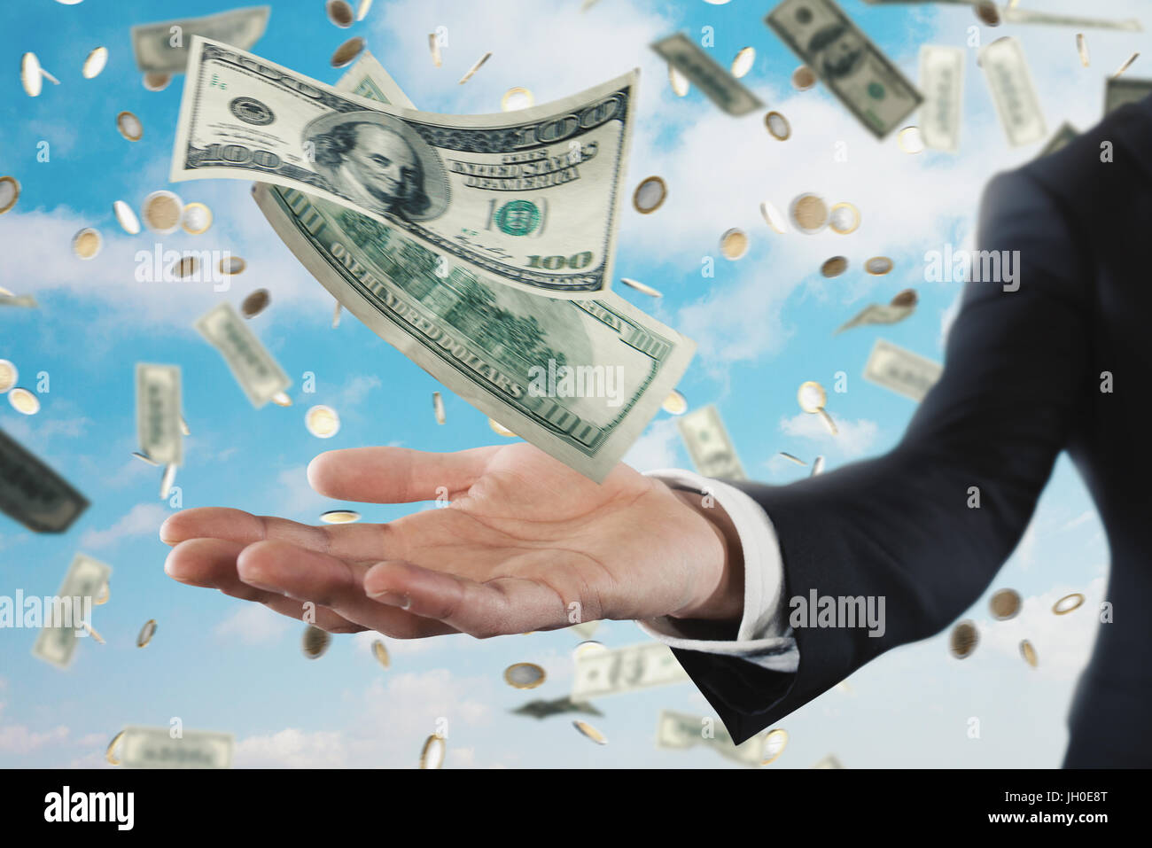 Businessman with rainy banknotes over sky background. Concept of ...