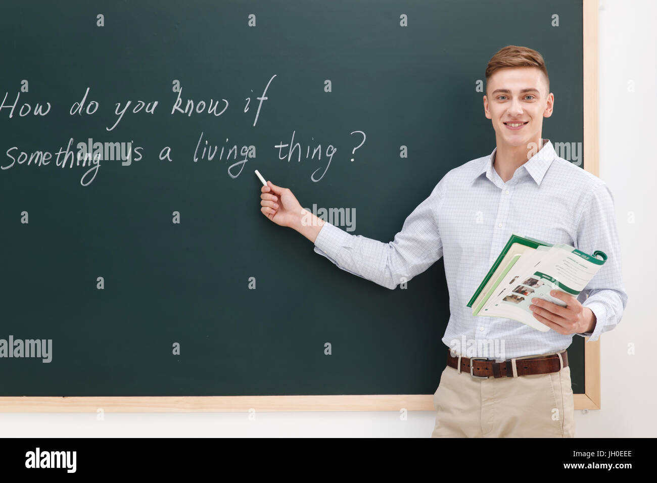 Teacher teaching in classroom Stock Photo - Alamy