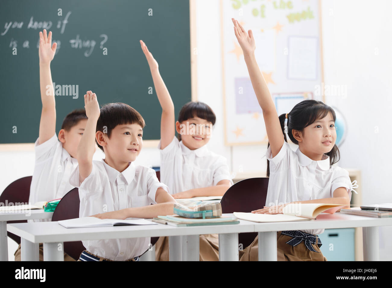 Students studying in classroom Stock Photo - Alamy