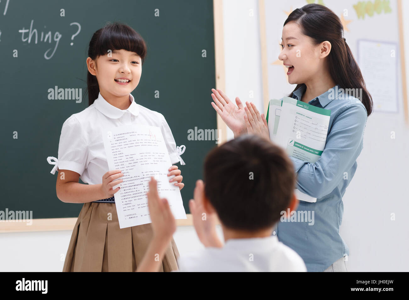 Elementary teacher clapping hi-res stock photography and images - Alamy