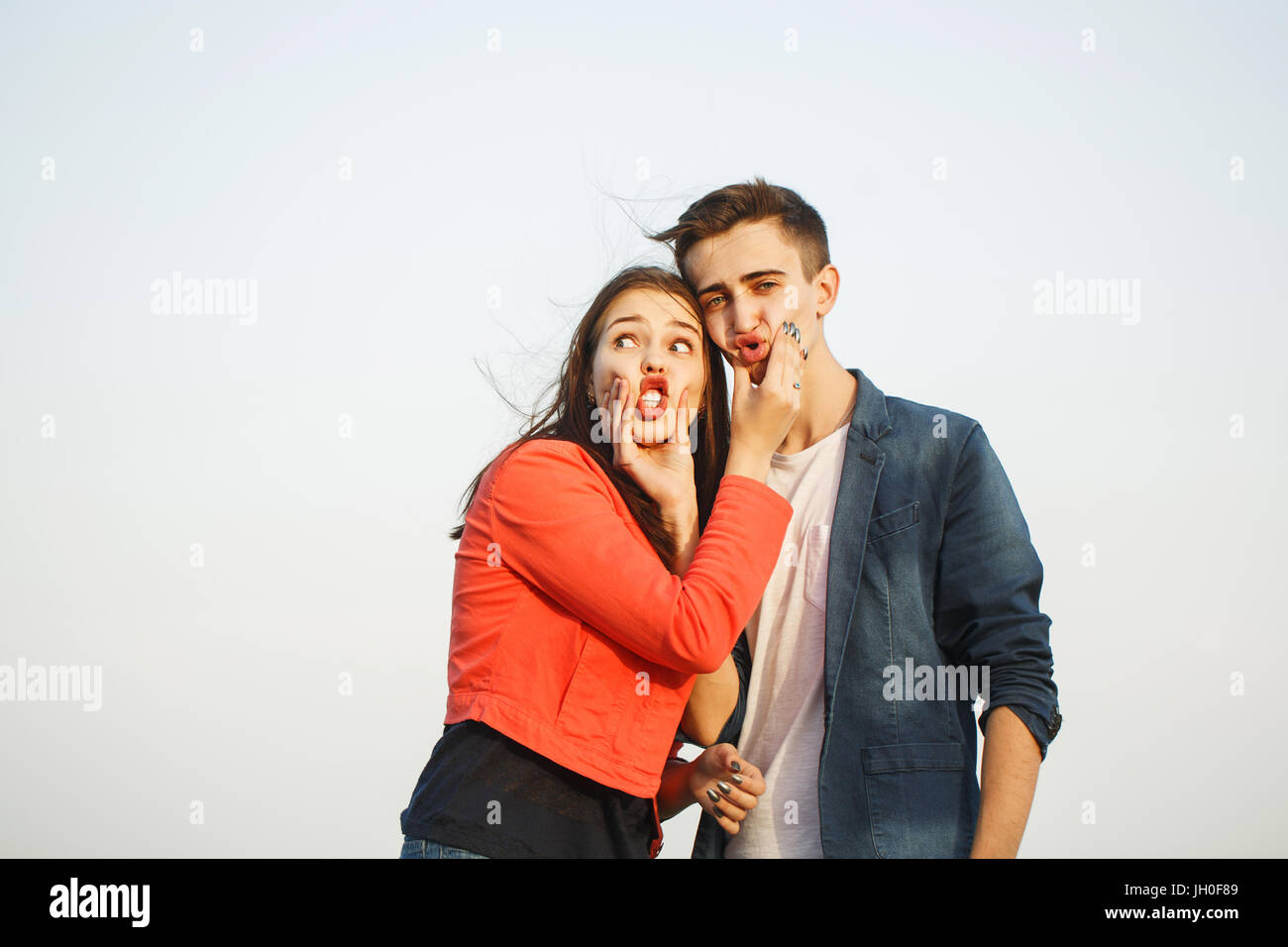 First love. Romantic hugs. Teenagers on a date. They fool around and ...