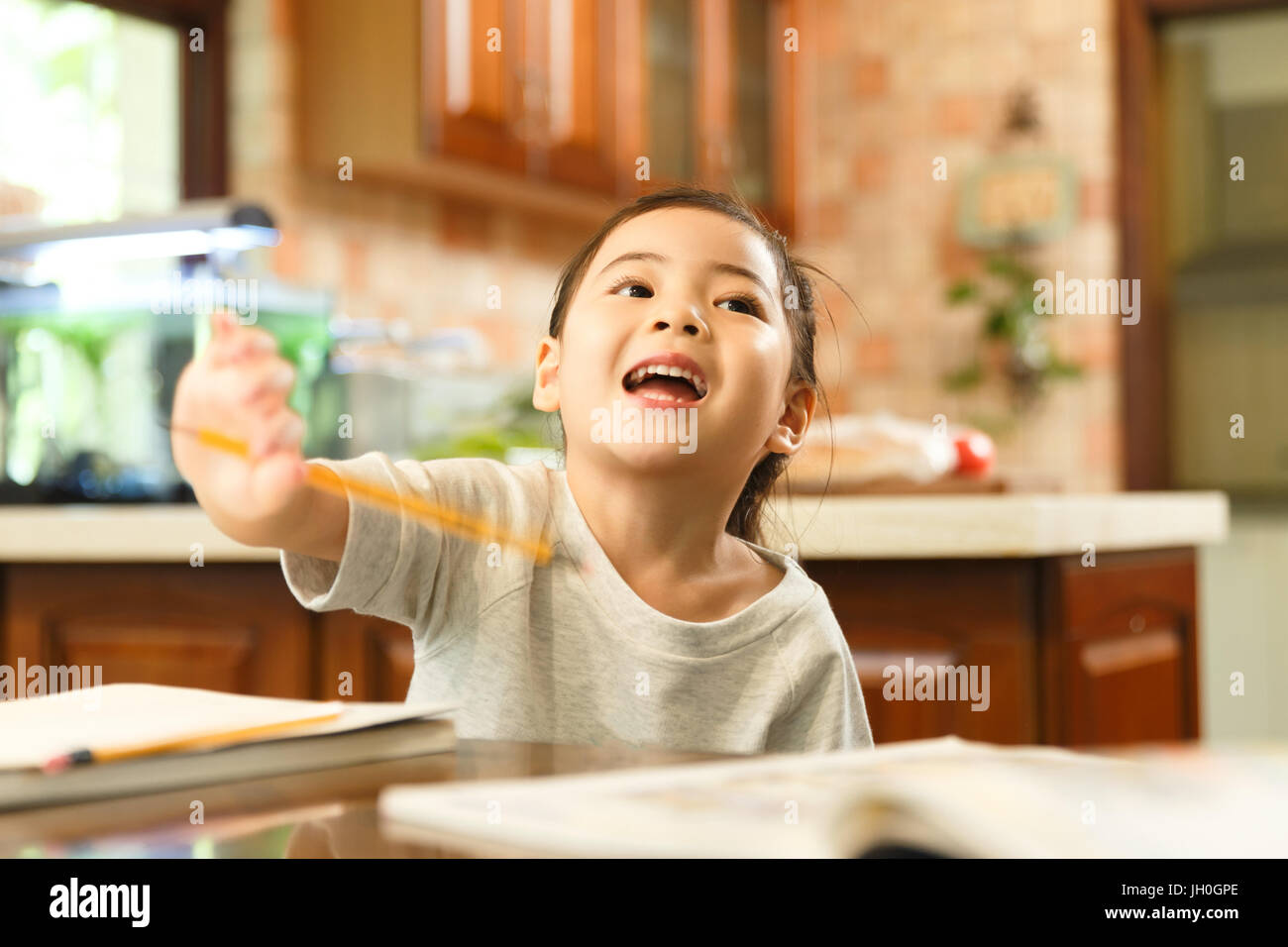 Little girl studying at home Stock Photo - Alamy