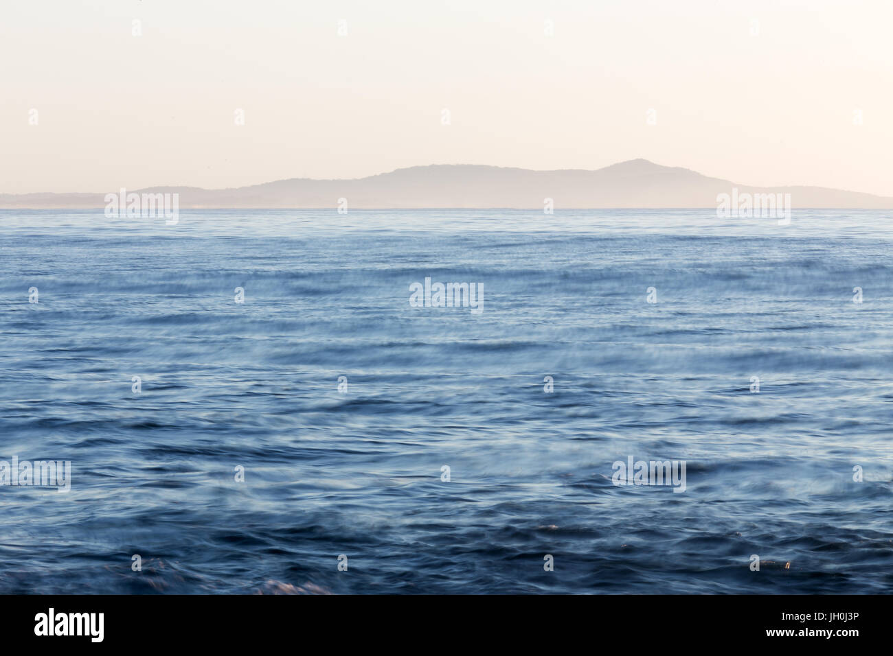 An empty body of ocean and a distant land mass on the east coast of ...