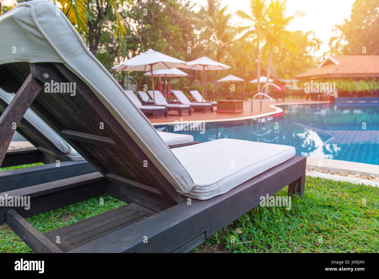 pool bed near swimming pool in tropical resort Stock Photo - Alamy