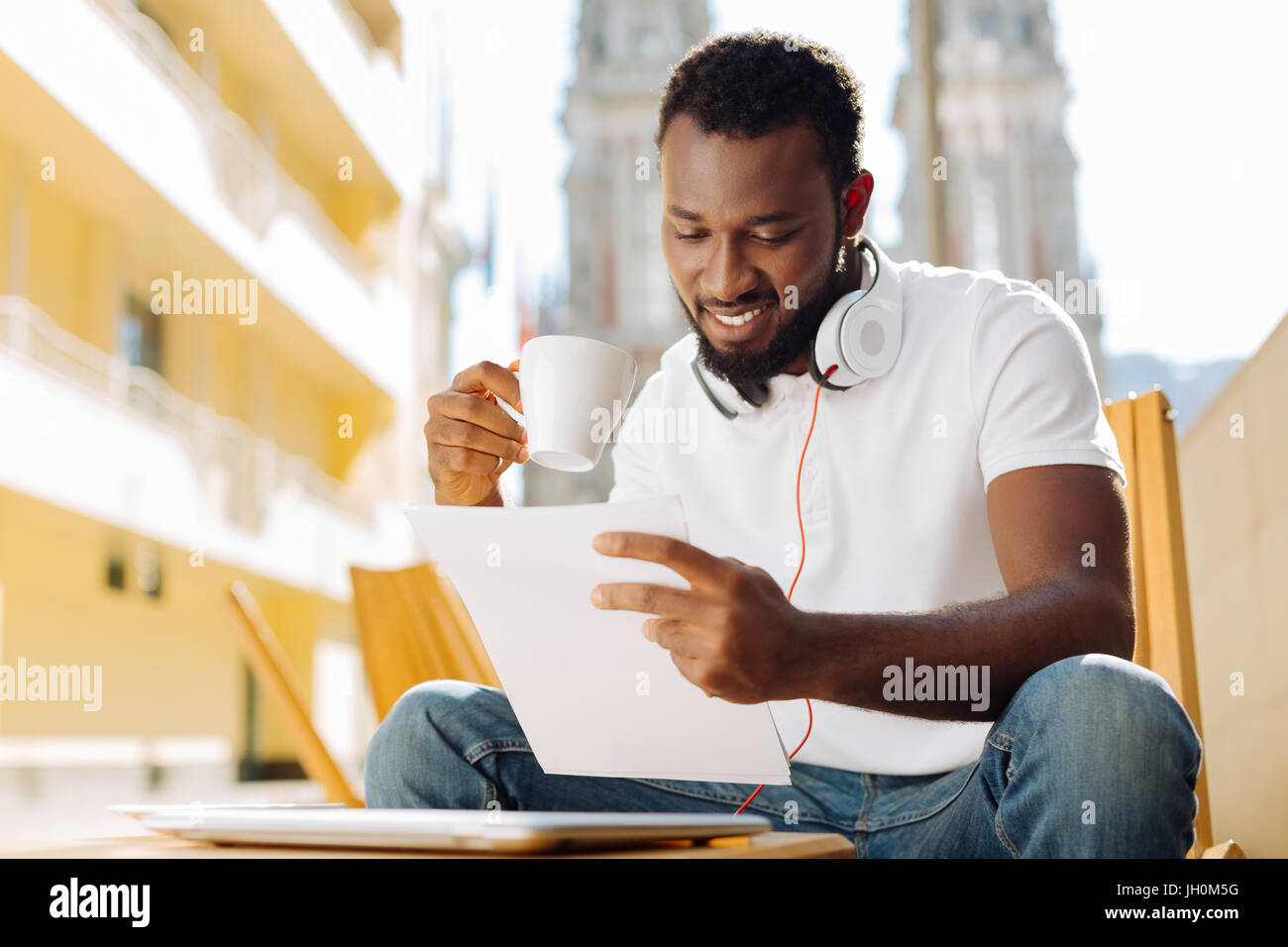 Clever committed guy delighted with results Stock Photo - Alamy