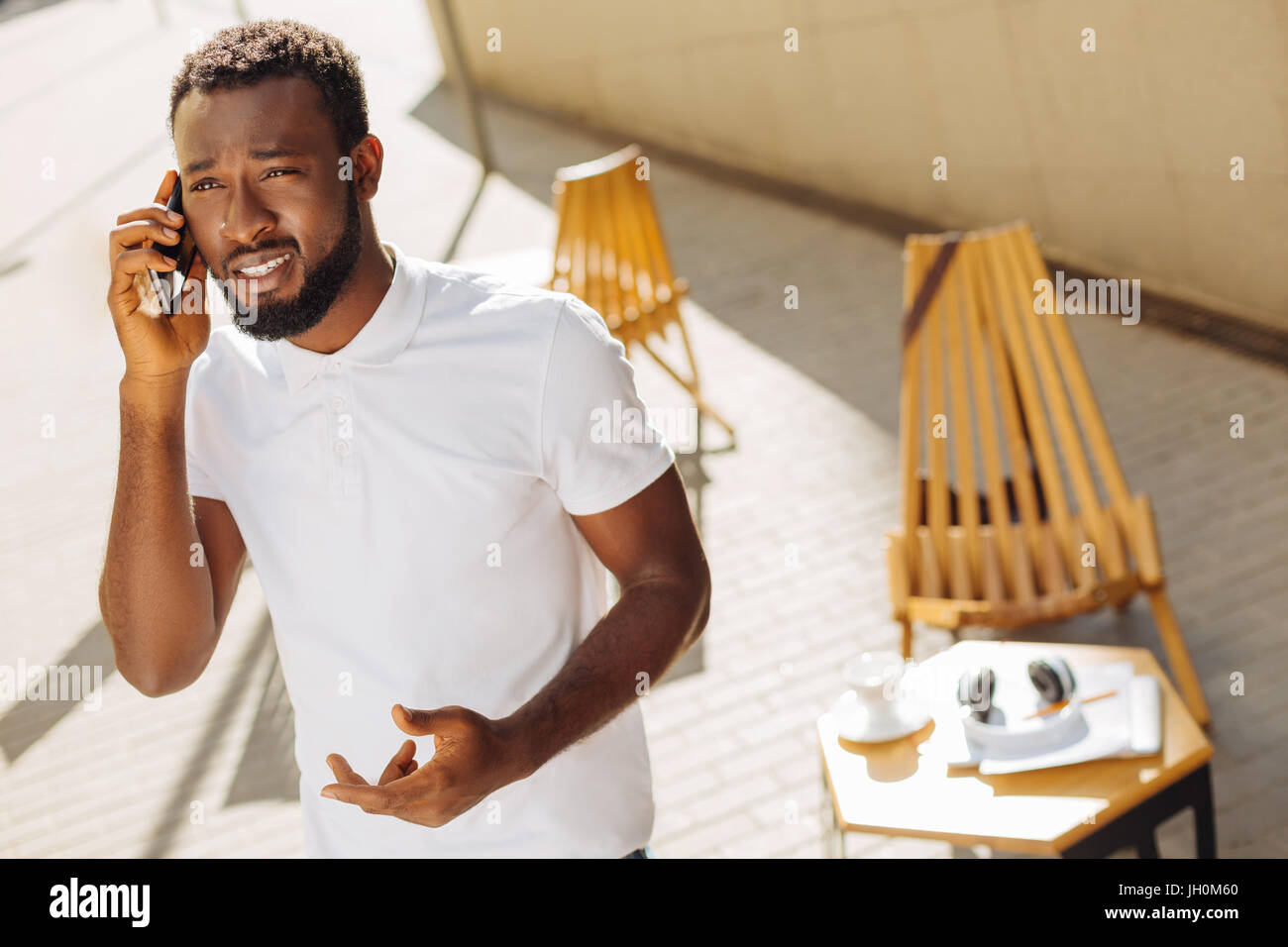 Young confident entrepreneur having a tense conversation Stock Photo ...