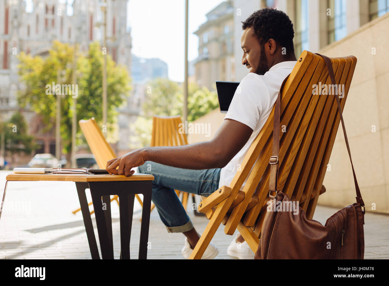 Passionate charismatic man checking his notifications Stock Photo - Alamy