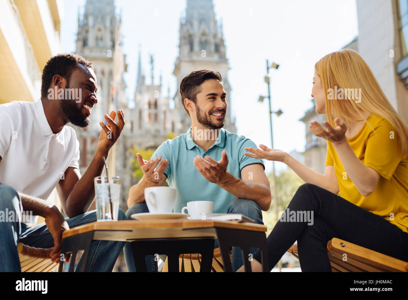 Cheerful amazing friends laughing together Stock Photo - Alamy