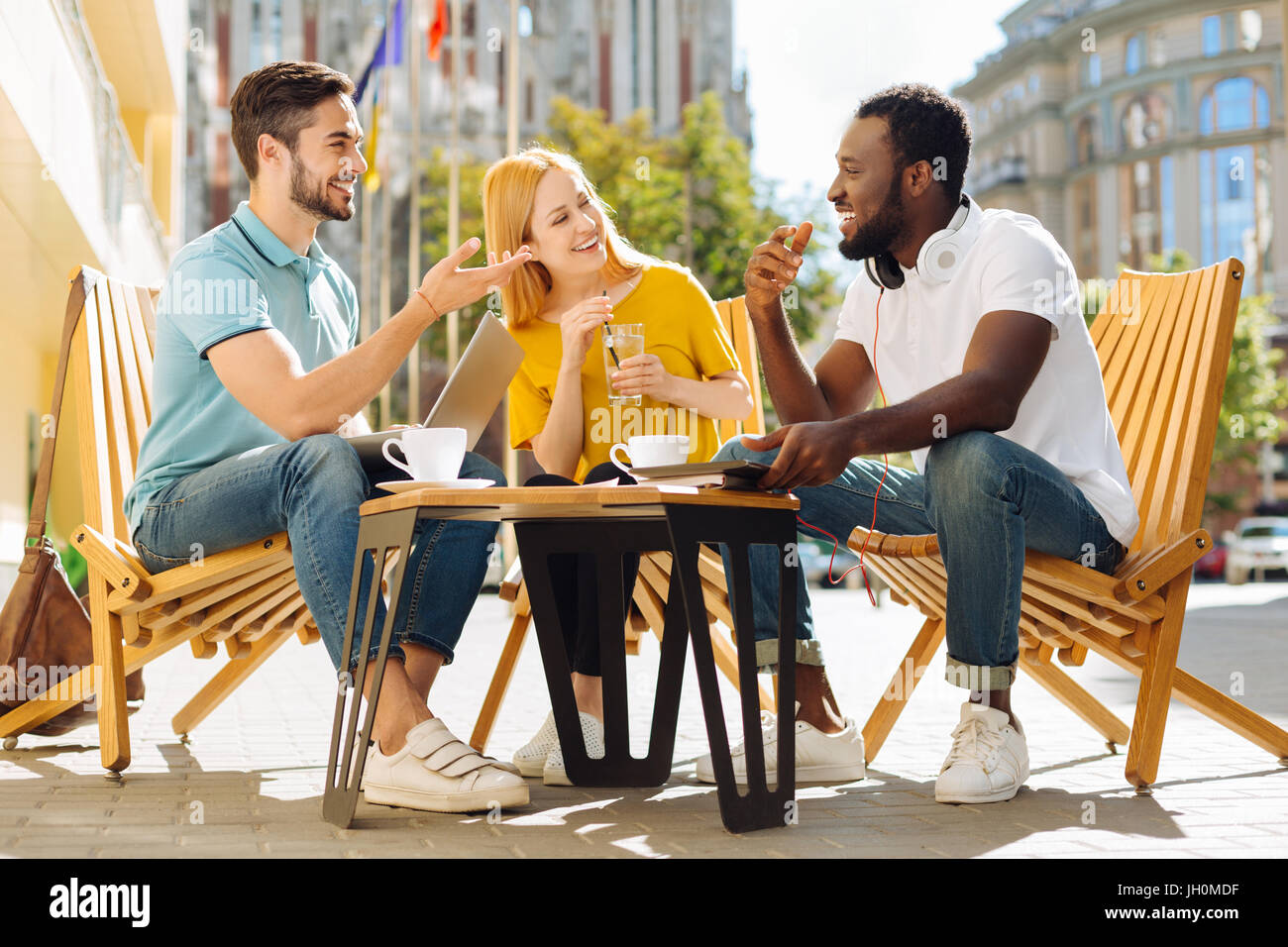 Productive passionate friends working in informal atmosphere Stock ...