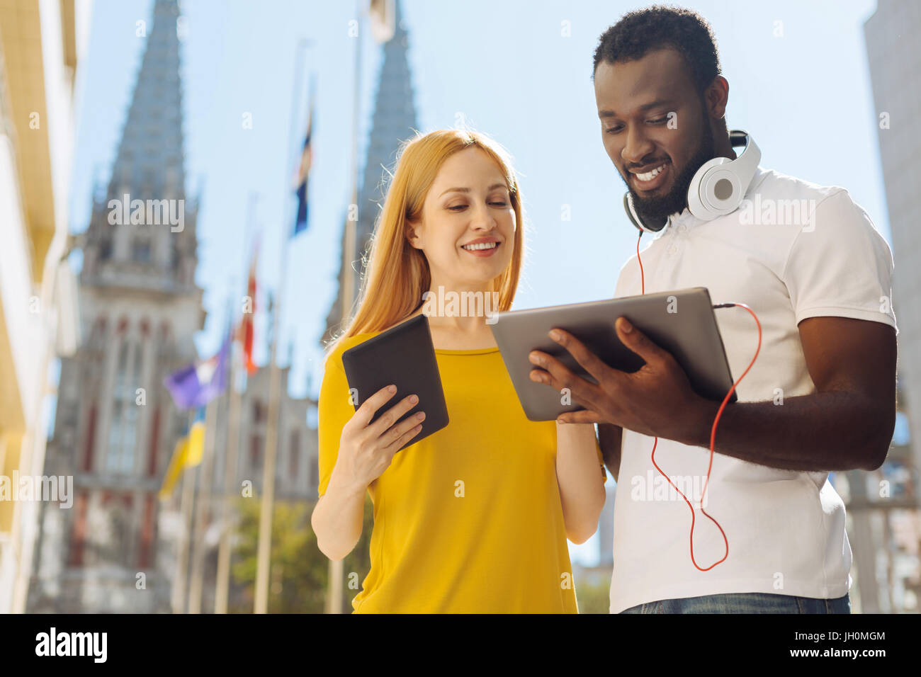 Portable computer. Sweet ambitious innovative guy meeting his friend ...