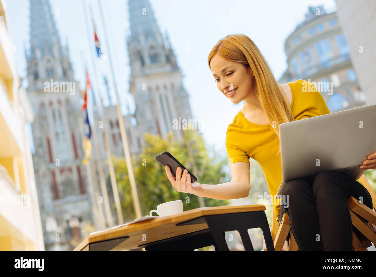 Classy serious woman checking her updates Stock Photo - Alamy